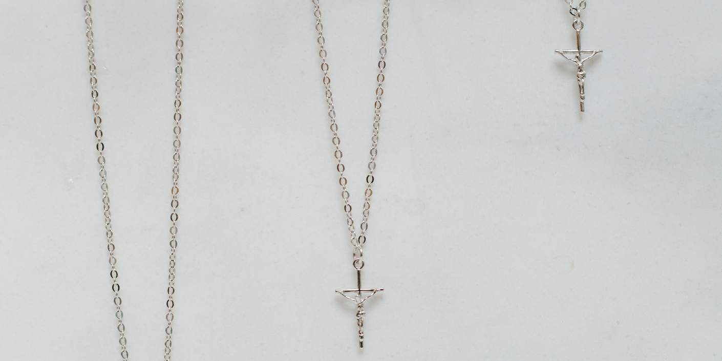 The History and Meaning of the Crucifix in Catholic Jewelry – West ...